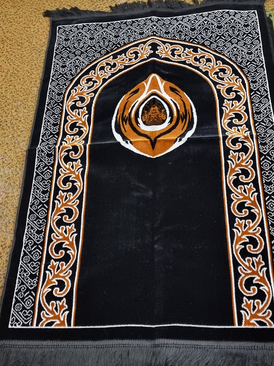 Black prayer mat with image of black stone – Dar al Taqwa